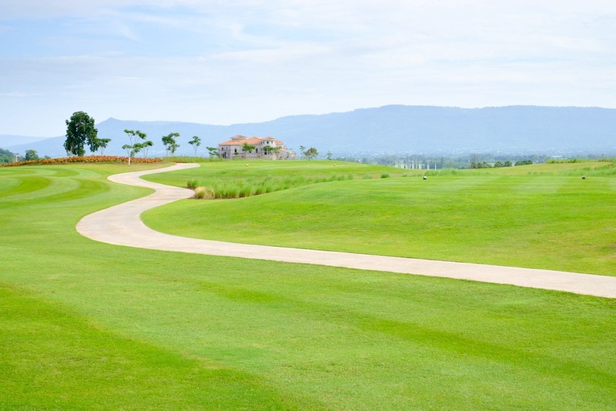 walkway on the green field in the golf club with beautiful view ...